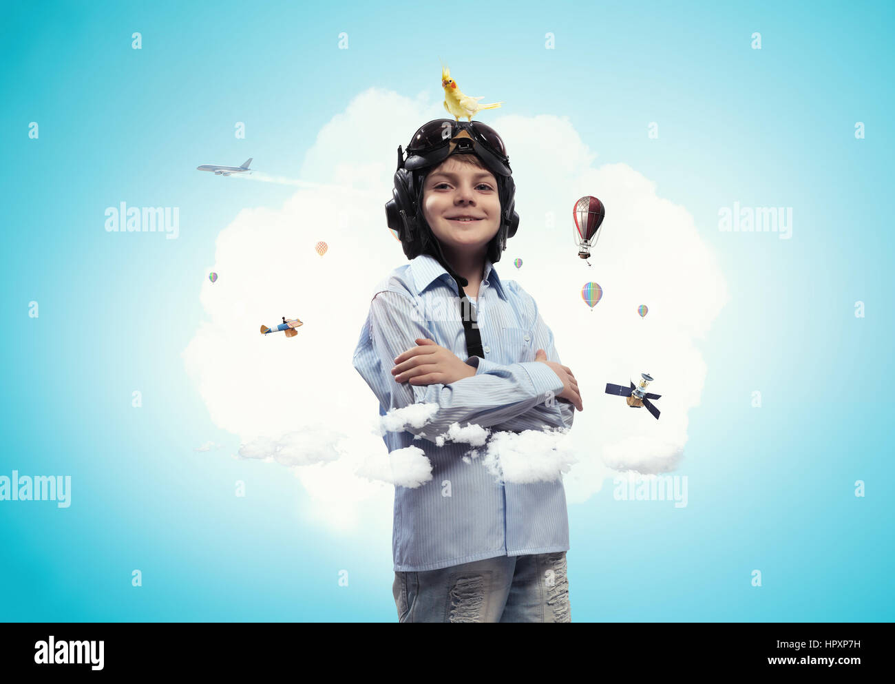 Little boy in pilots helmet on blue background. Mixed media Stock Photo ...
