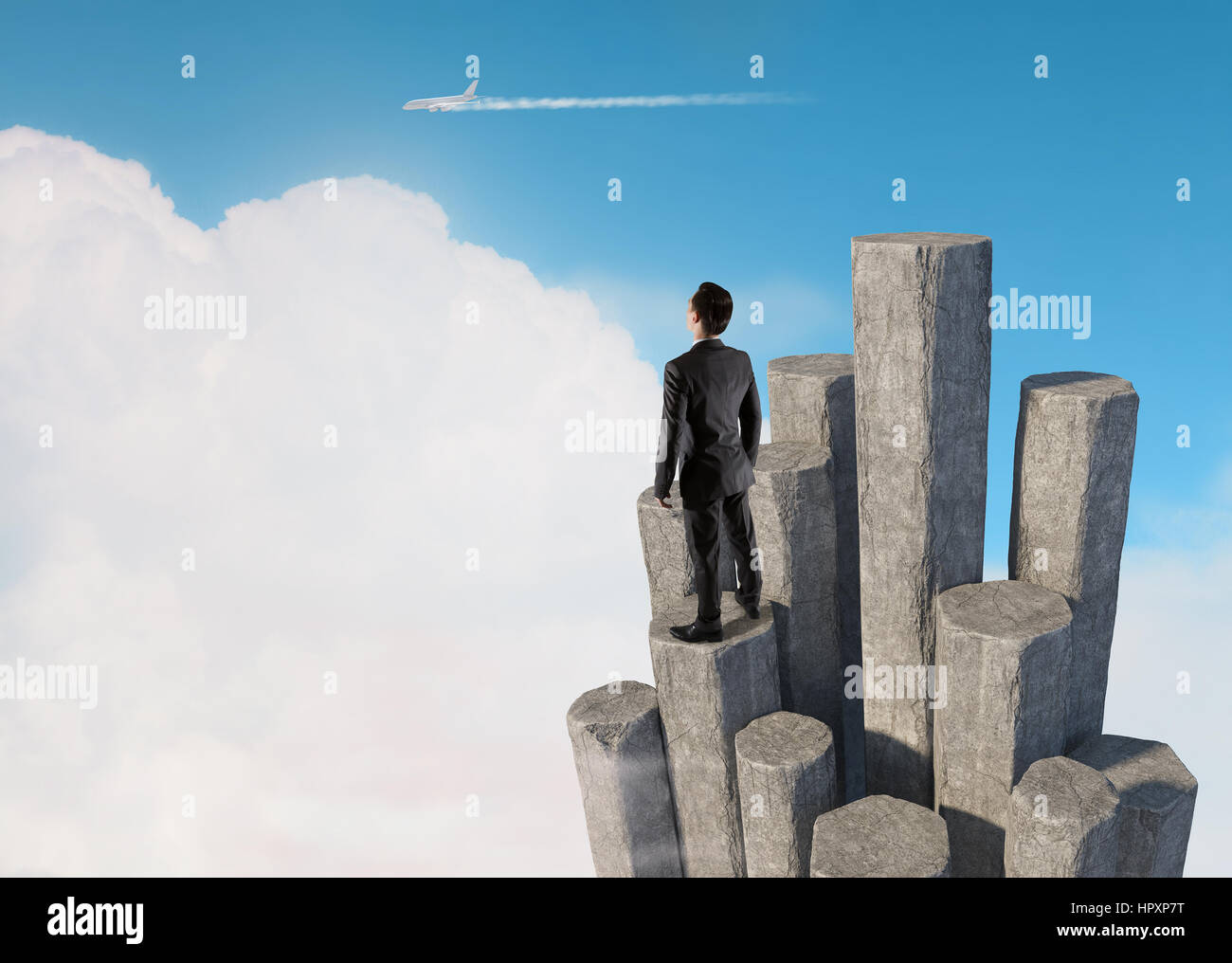 Elegant professional businessman standing on top stone column Stock ...