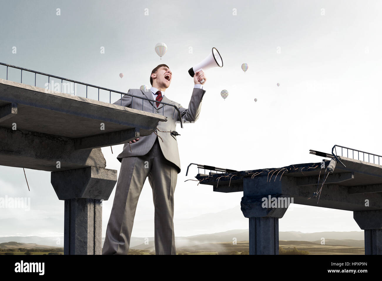 Giant businessman with long legs looking away. Mixed media Stock Photo ...