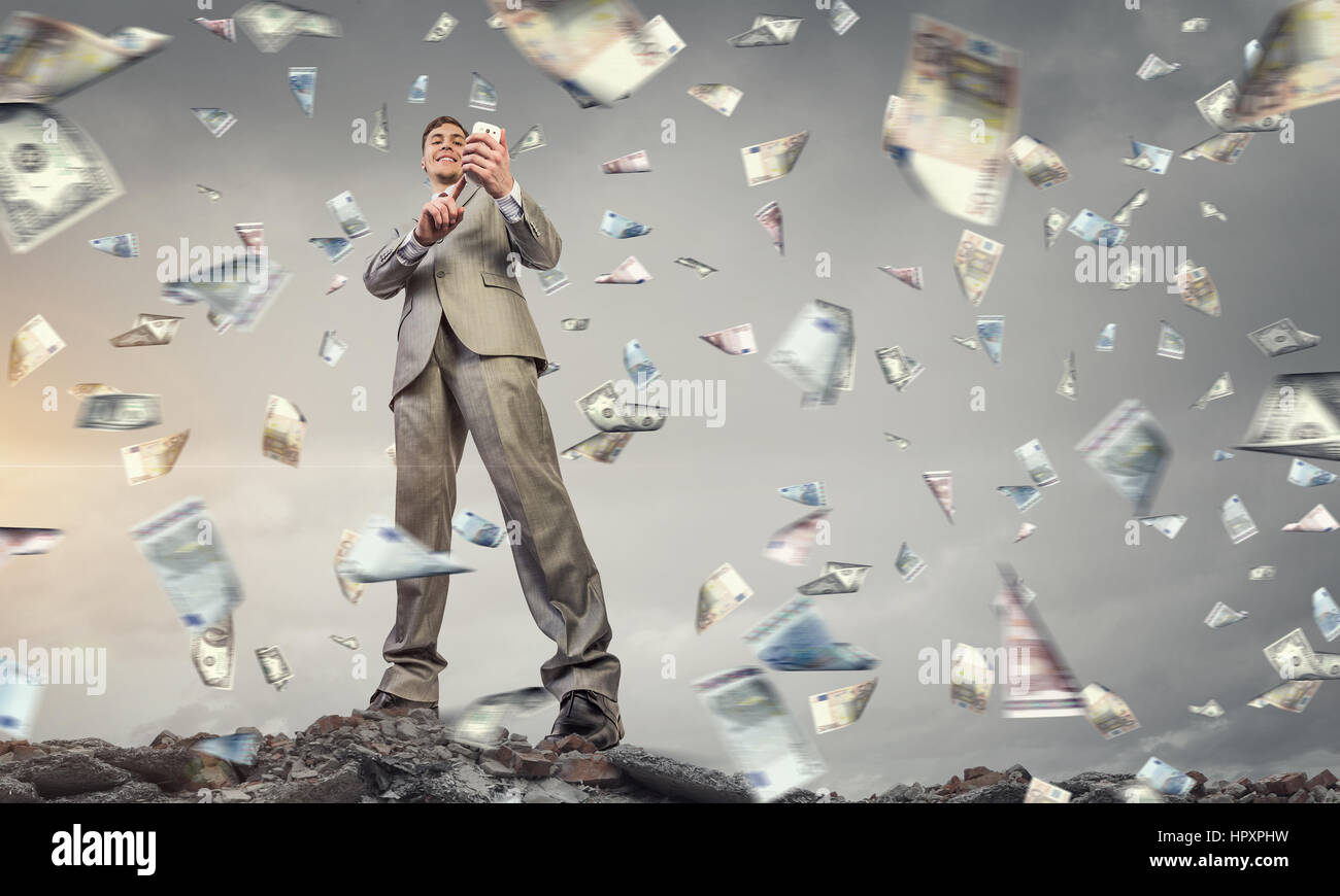 Giant businessman with long legs looking away Stock Photo - Alamy