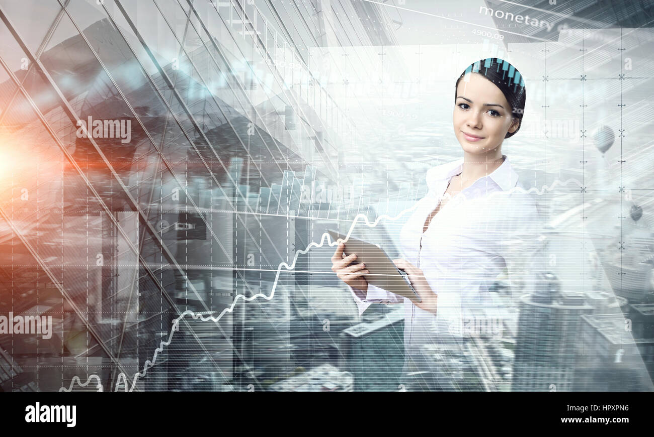 Attractive businesswoman using tablet pc against modern city background ...