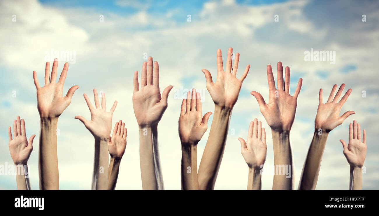 Row of raised hands showing different gestures Stock Photo - Alamy