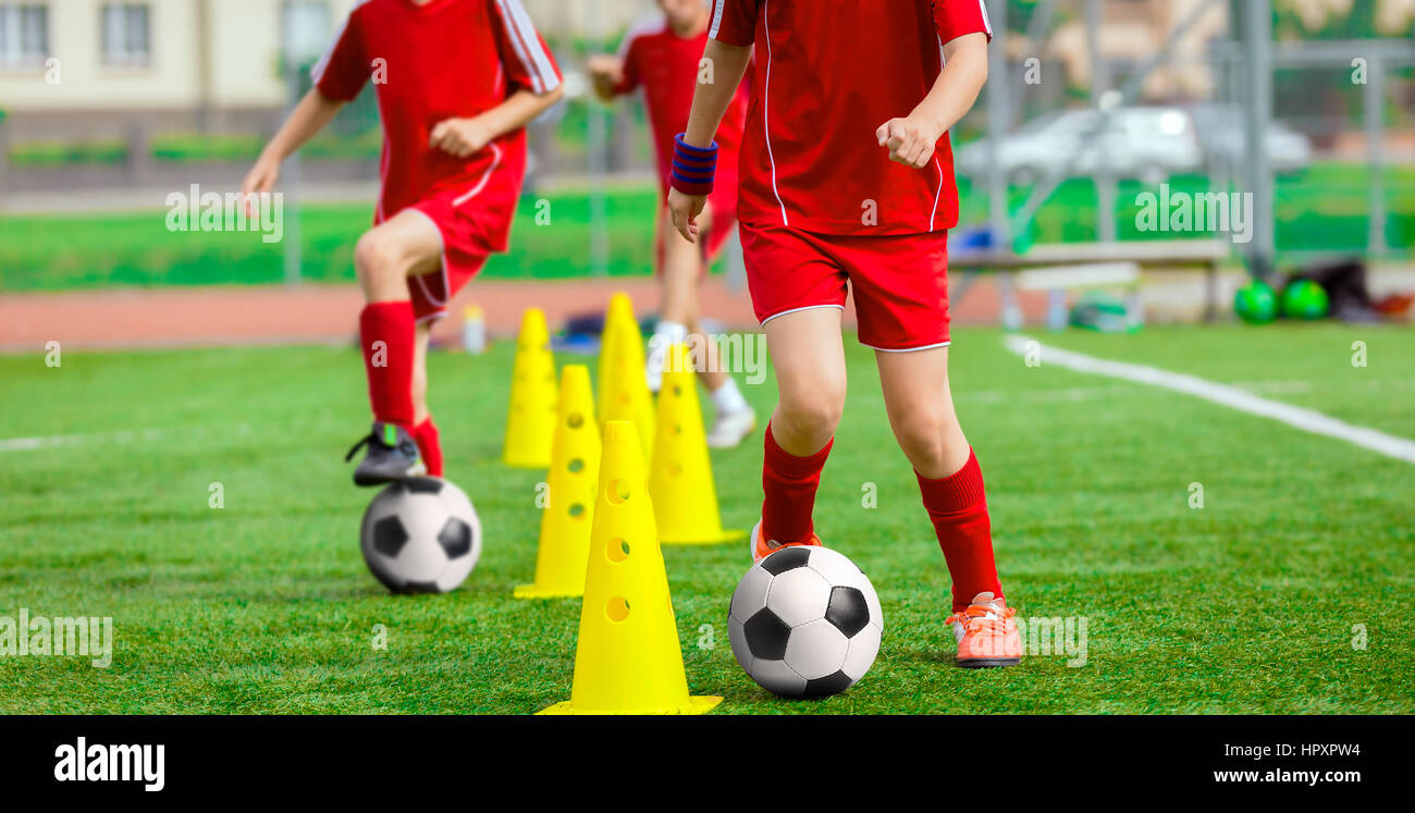 Soccer Ball and Pylons on Grass. Youth Soccer Player Training. Young ...