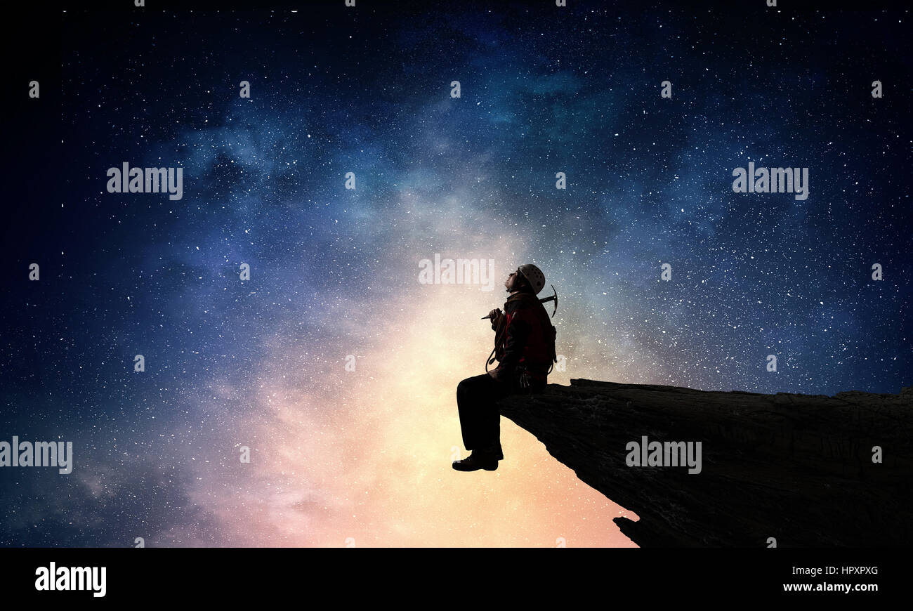 Man Sitting On Cliff Edge