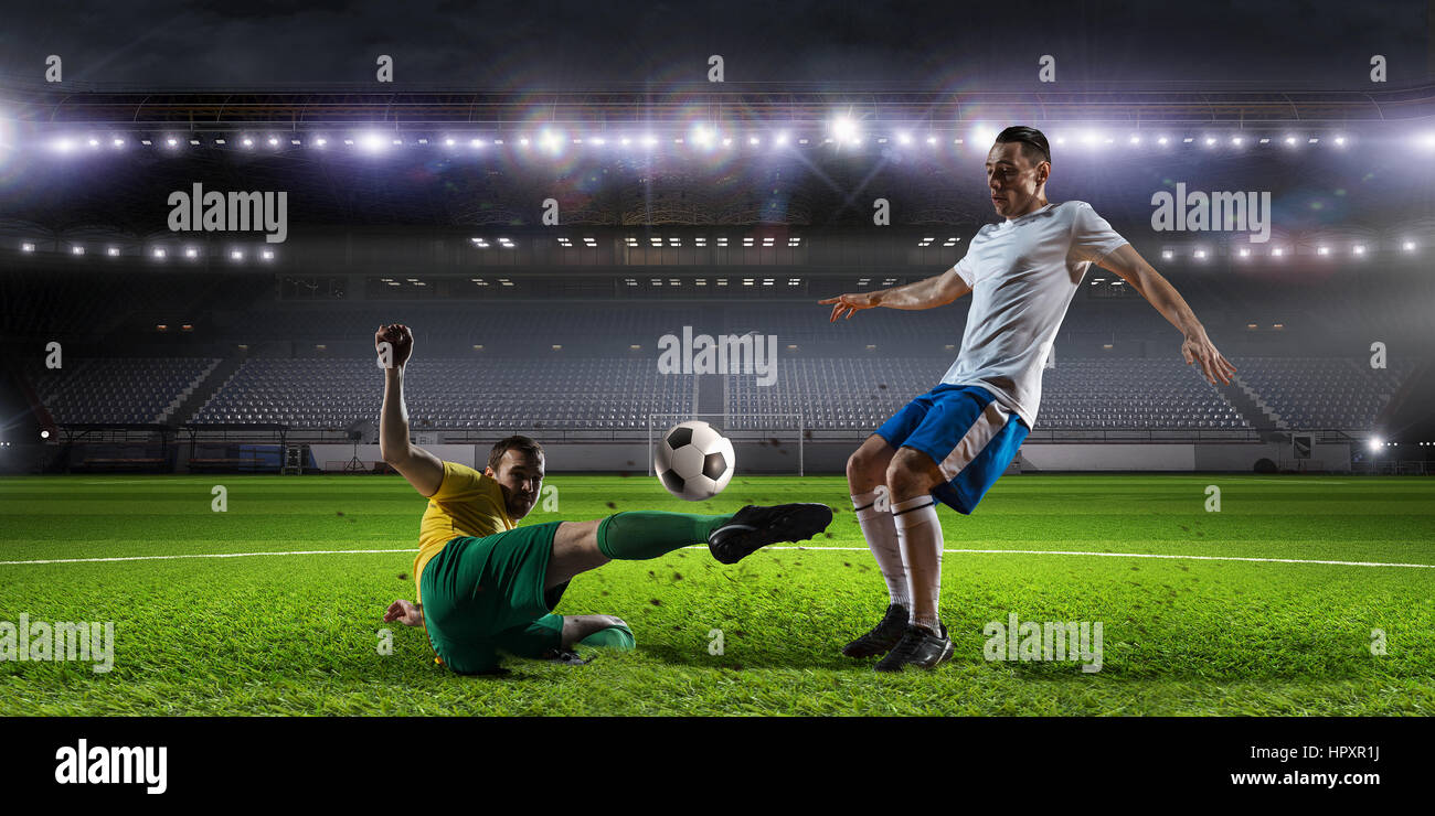 Soccer players in action on stadium fighting for ball. Mixed media ...