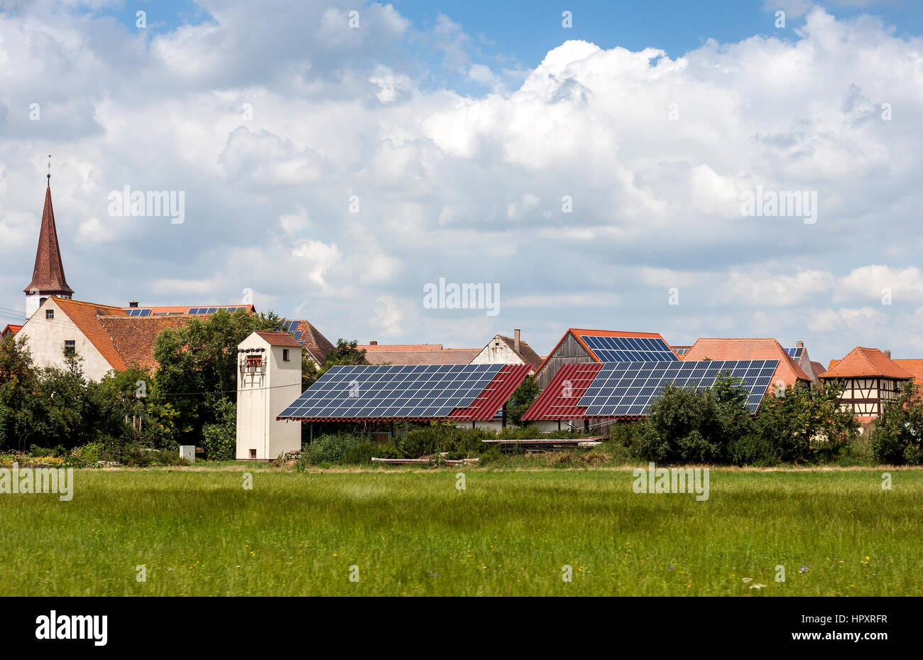 Solar powered homes in a rural village in Germany. Solar panels on roof ...
