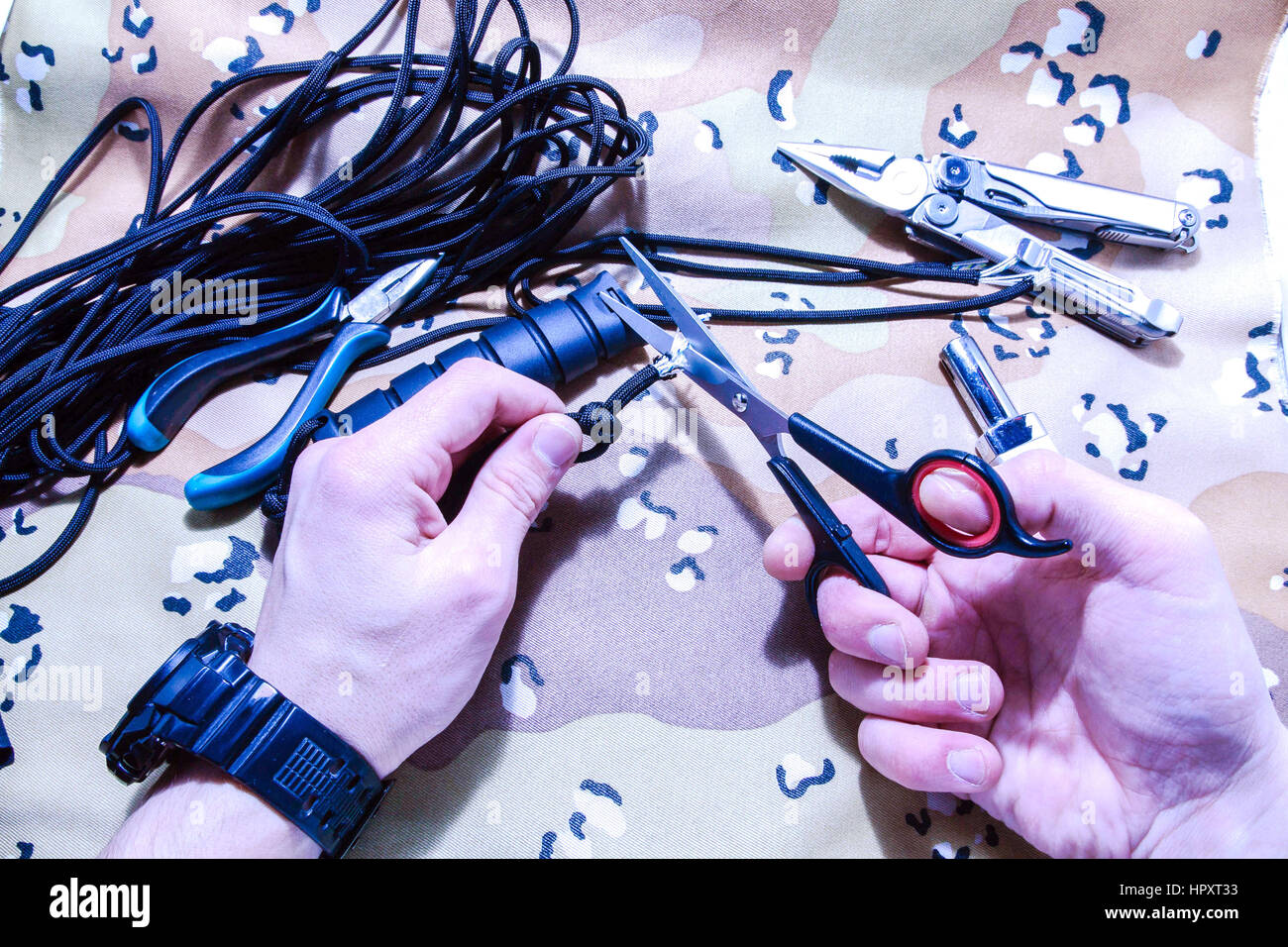 Man make military lanyard. DIY Craft Handmade Stock Photo - Alamy