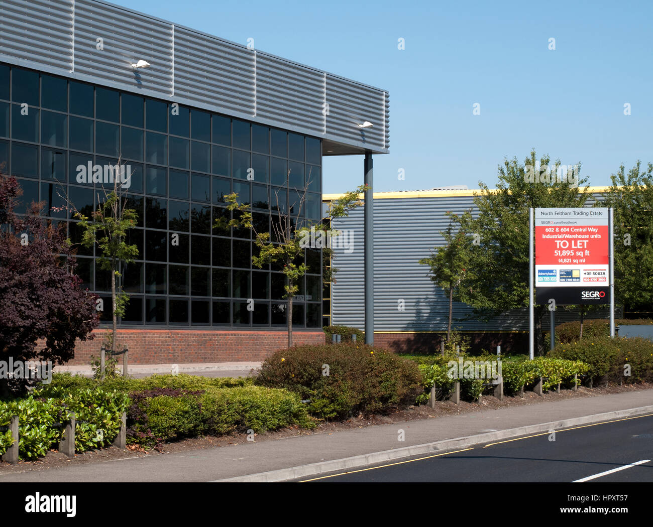 Estate agents industrial warehouse units to let sign Stock Photo - Alamy