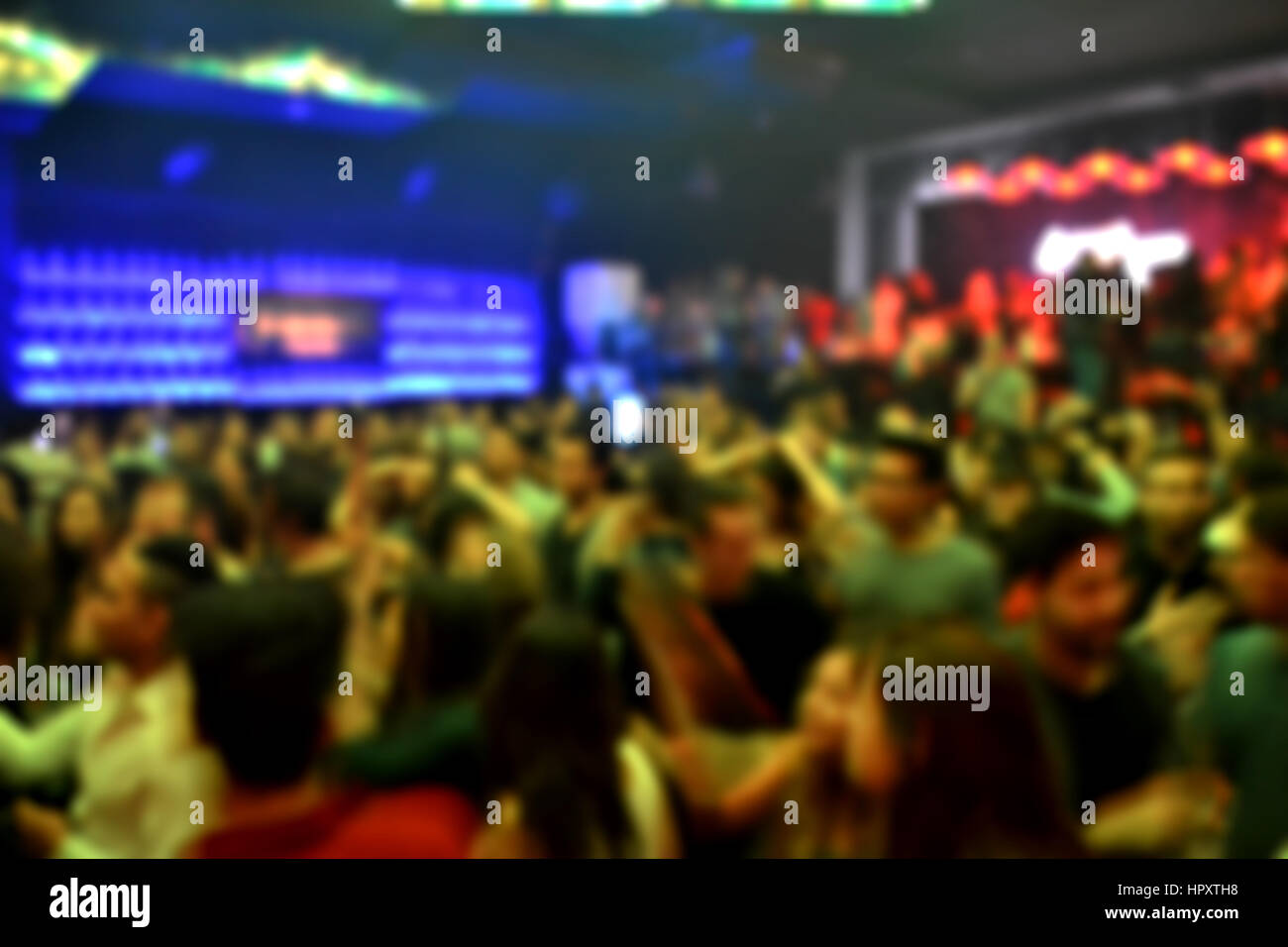 Blurred background of a crowd in an indoor party Stock Photo - Alamy