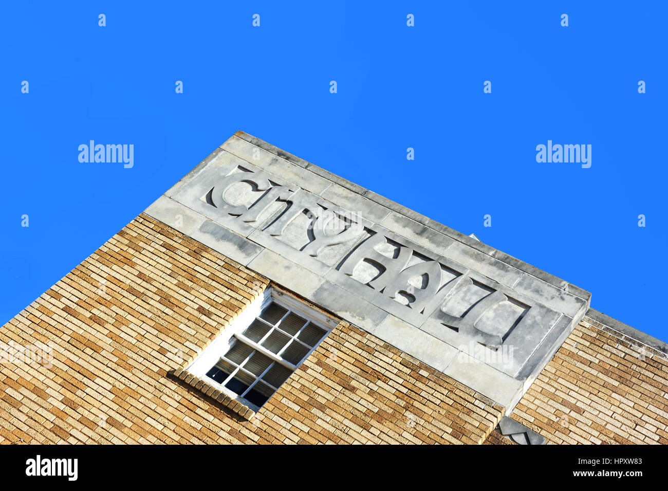 City Hall in Eudora, Arkansas is framed by blue sky. Tilted angle image ...
