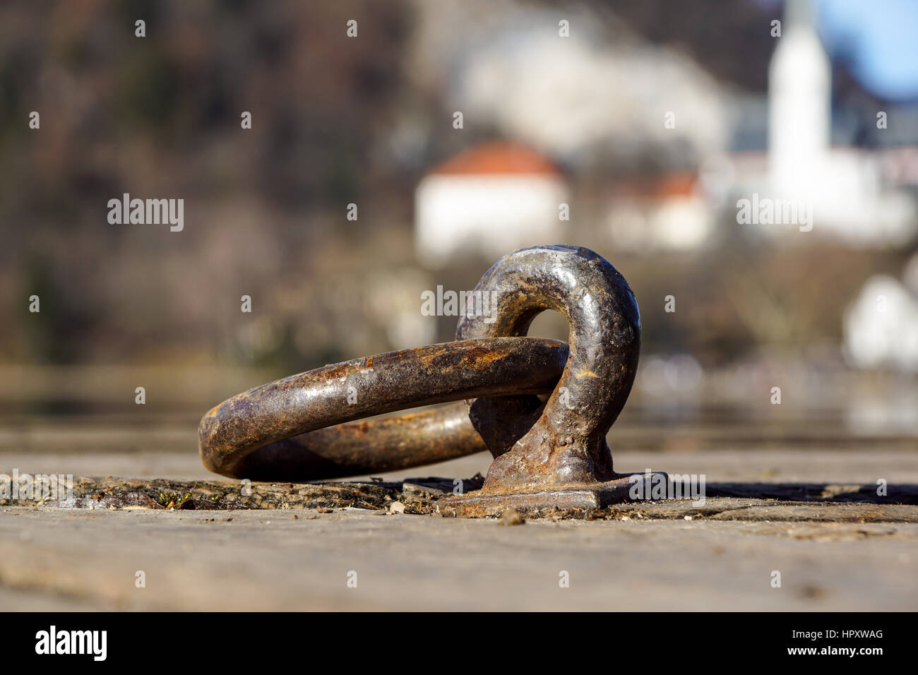Large metal hooks on quay for mooring boats Stock Photo - Alamy