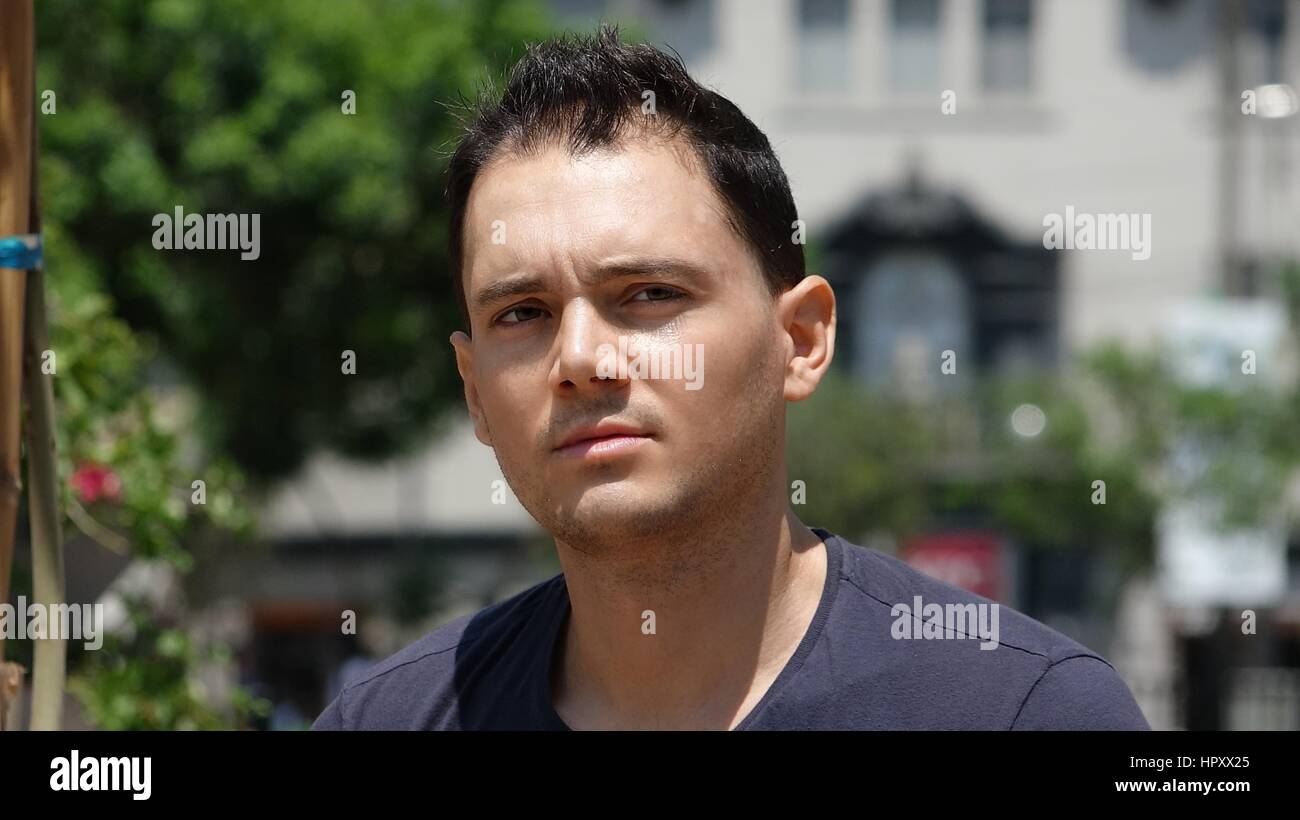 Serious Man Gazing In Urban Park Stock Photo - Alamy