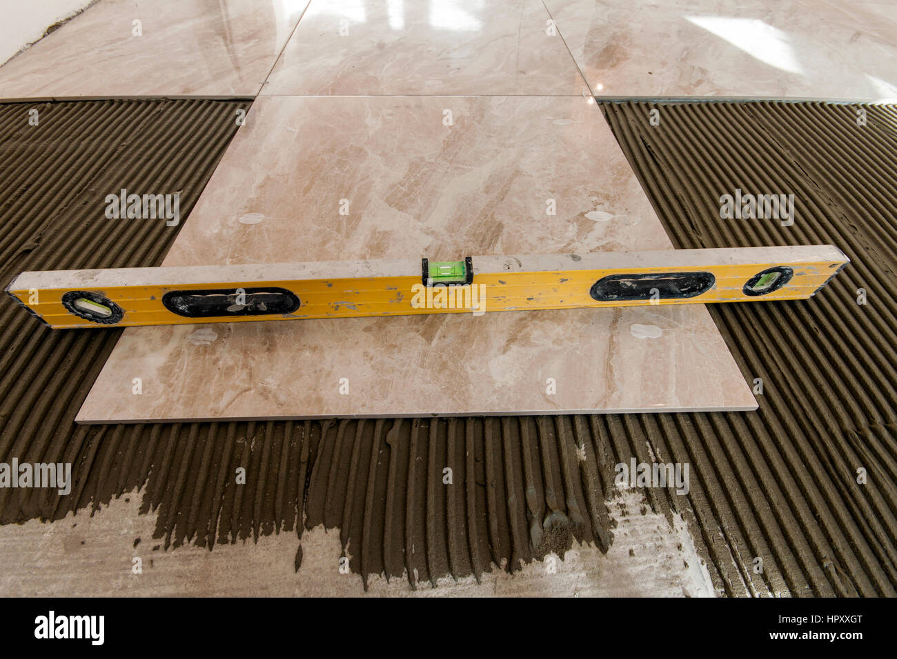 Ceramic tiles and tools for tiler. Floor tiles installation. Home ...