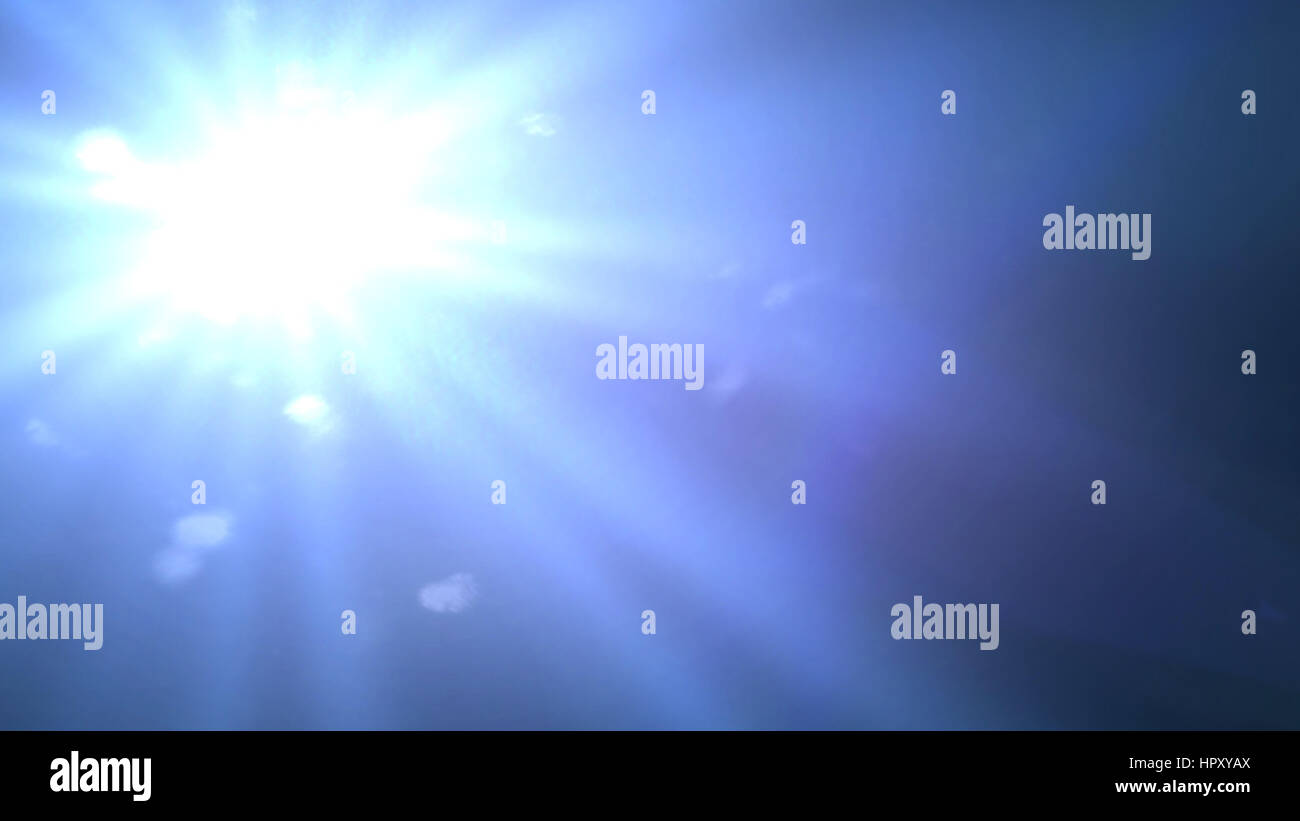 bright sun in blue sky with lens flare effect Stock Photo - Alamy