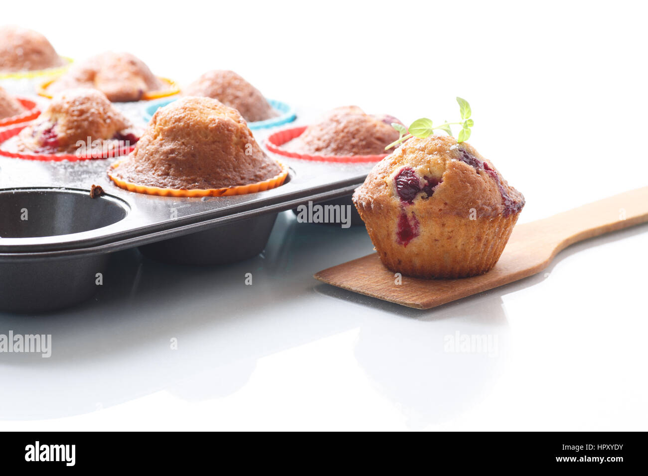sweet muffins with berries inside on a white background Stock Photo - Alamy