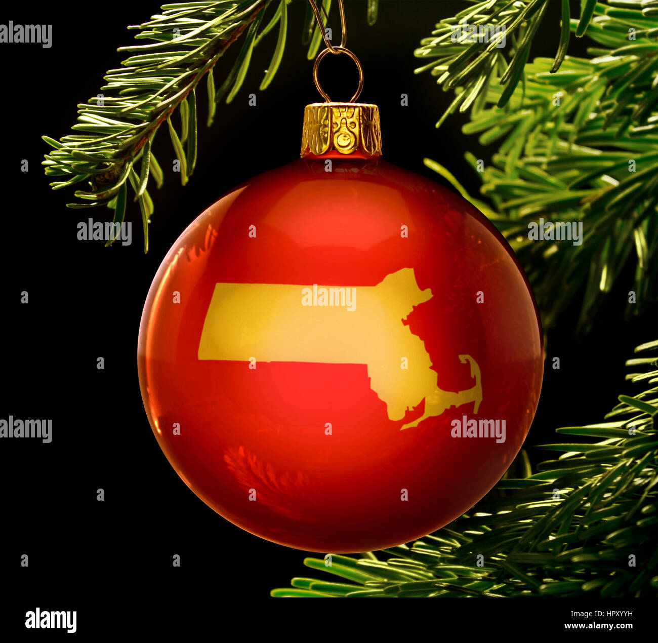 A red bauble with the golden shape of Massachusetts hanging on a ...