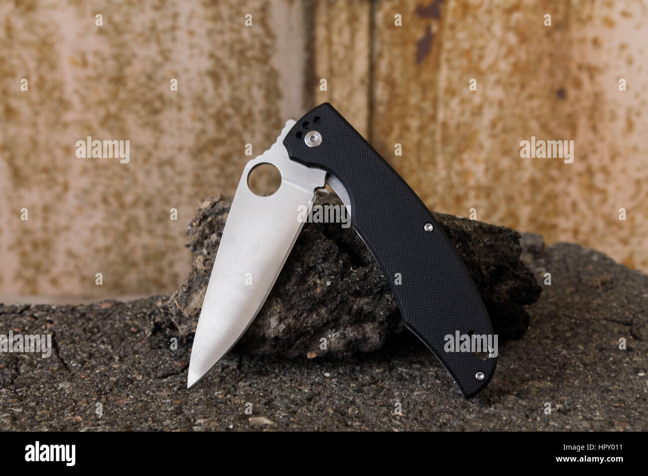 Knife in the half-folded. Knife on the background of the asphalt Stock ...