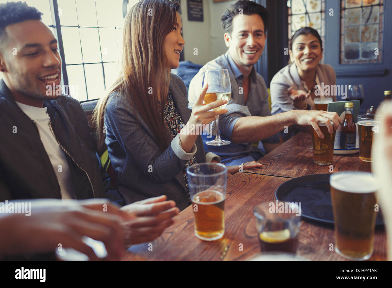 Man sitting in a pub drinking a pint of beer hi-res stock photography ...