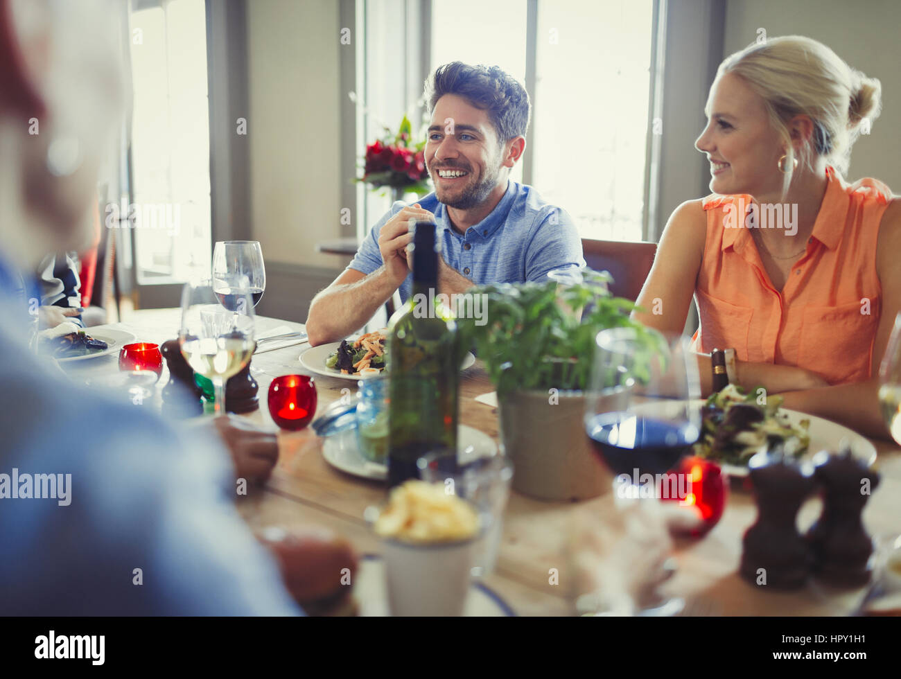 Smiling couple dining at restaurant table Stock Photo - Alamy