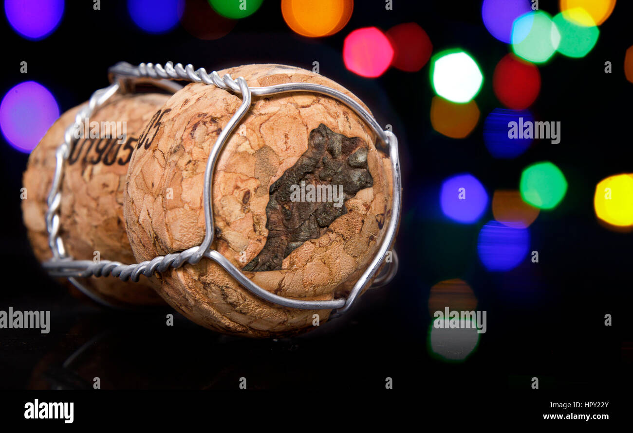 Champagne cork with the shape of Morocco burnt in and colorful blurry ...