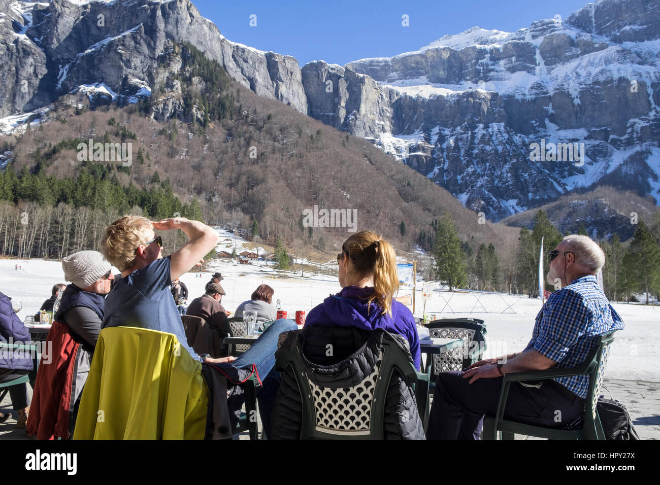Family dining outside Chalet du Cirque du Fer A Cheval bar restaurant ...