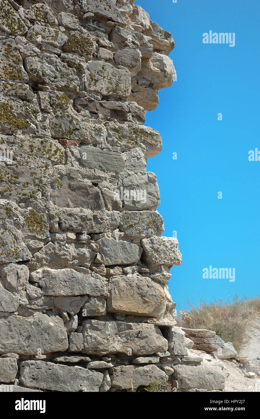 collapsed stone wall in ruins on sky background Stock Photo - Alamy