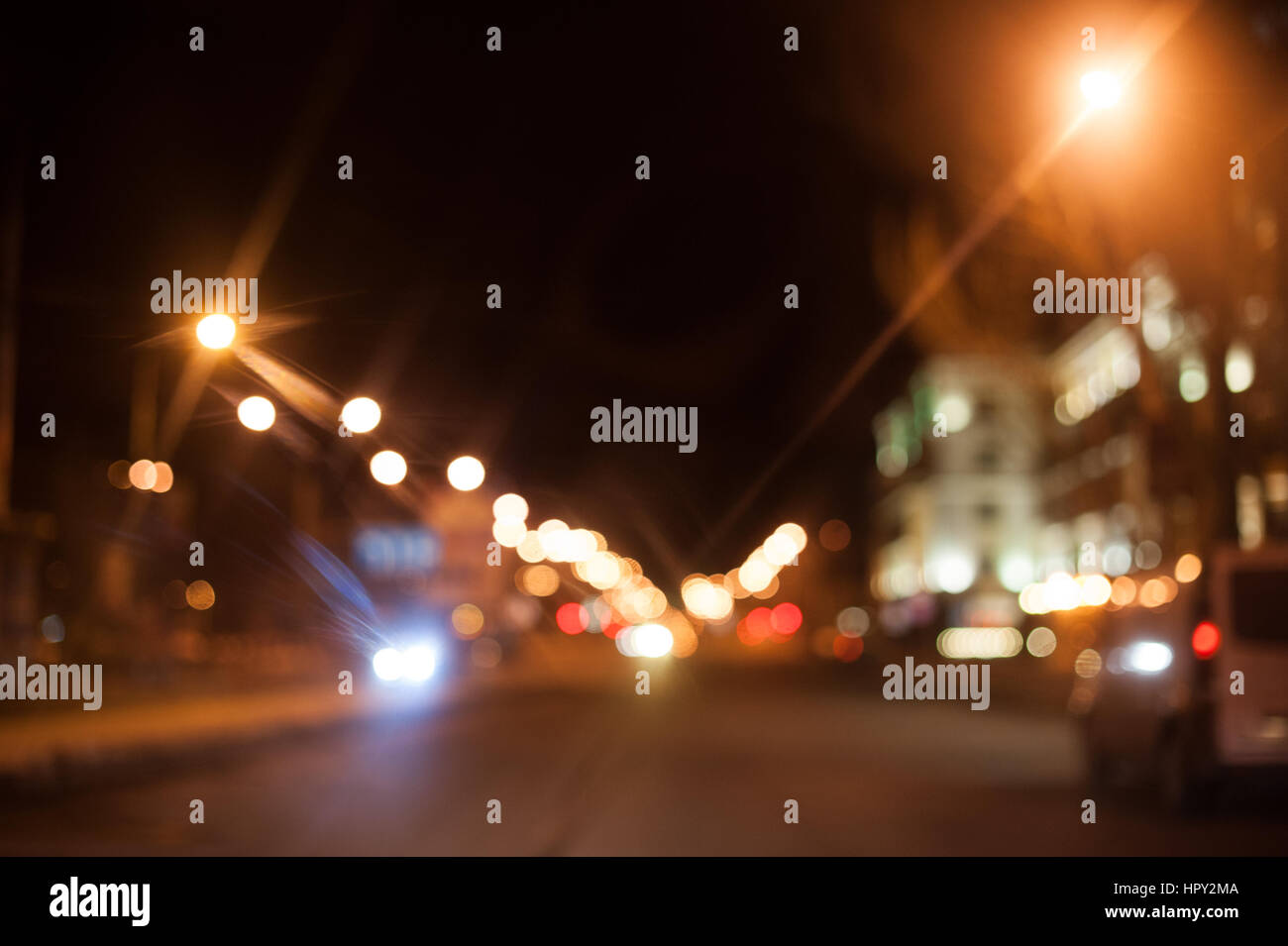 Night city street lighting lanterns and cars Stock Photo - Alamy