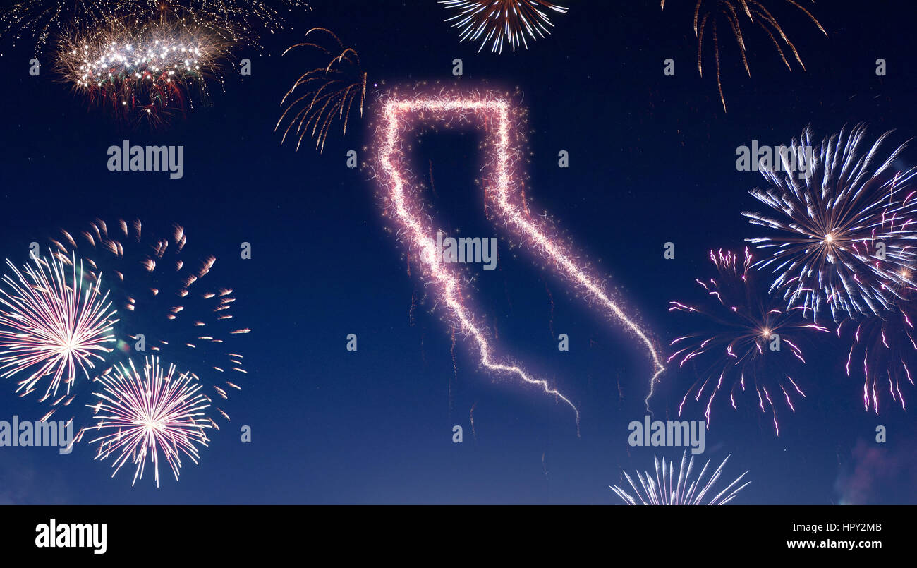 A dark night sky with a sparkling red firecracker in the shape of ...