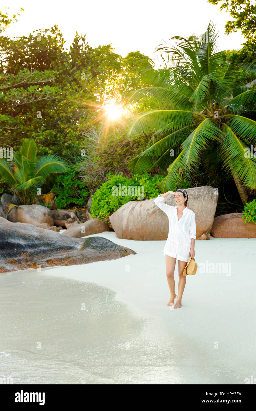 Beautiful woman enjoying the beautiful beachs of Praslin, Seychelles ...