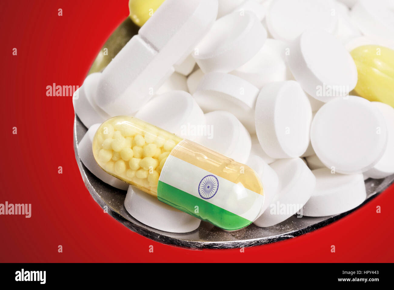 The national flag of India on a capsule and pills on a spoon.(series ...