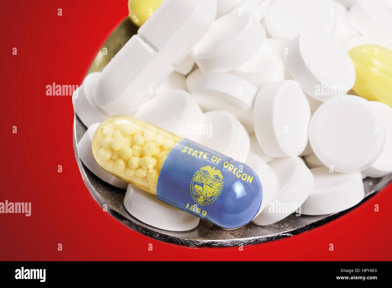 The national flag of Oregon on a capsule and pills on a spoon.(series ...
