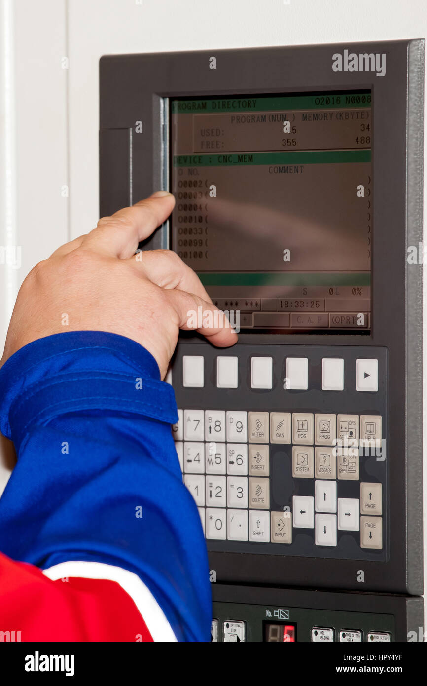 Automated workplace, engineer's hand on the working computer panel of ...