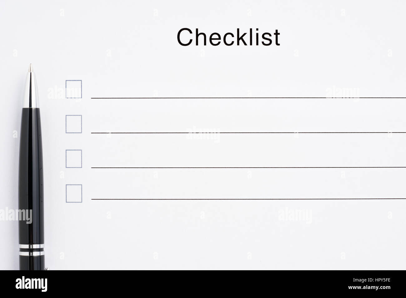 Checklist close-up and pen Stock Photo - Alamy