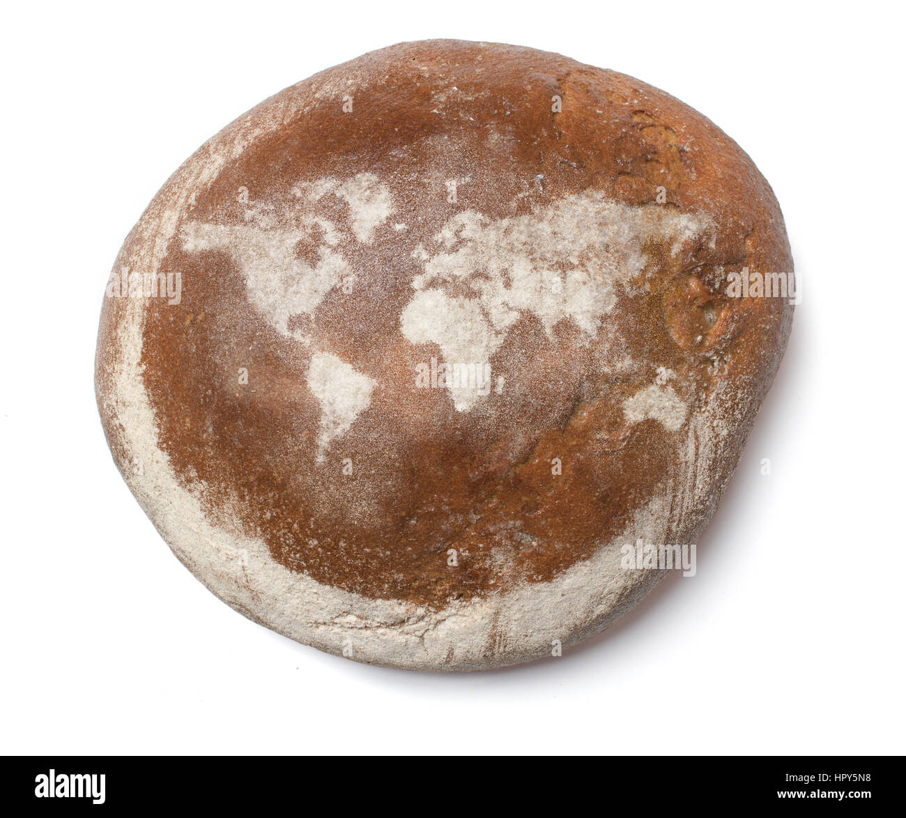 A freshly baked loaf of bread covered with rye flour in the shape of ...