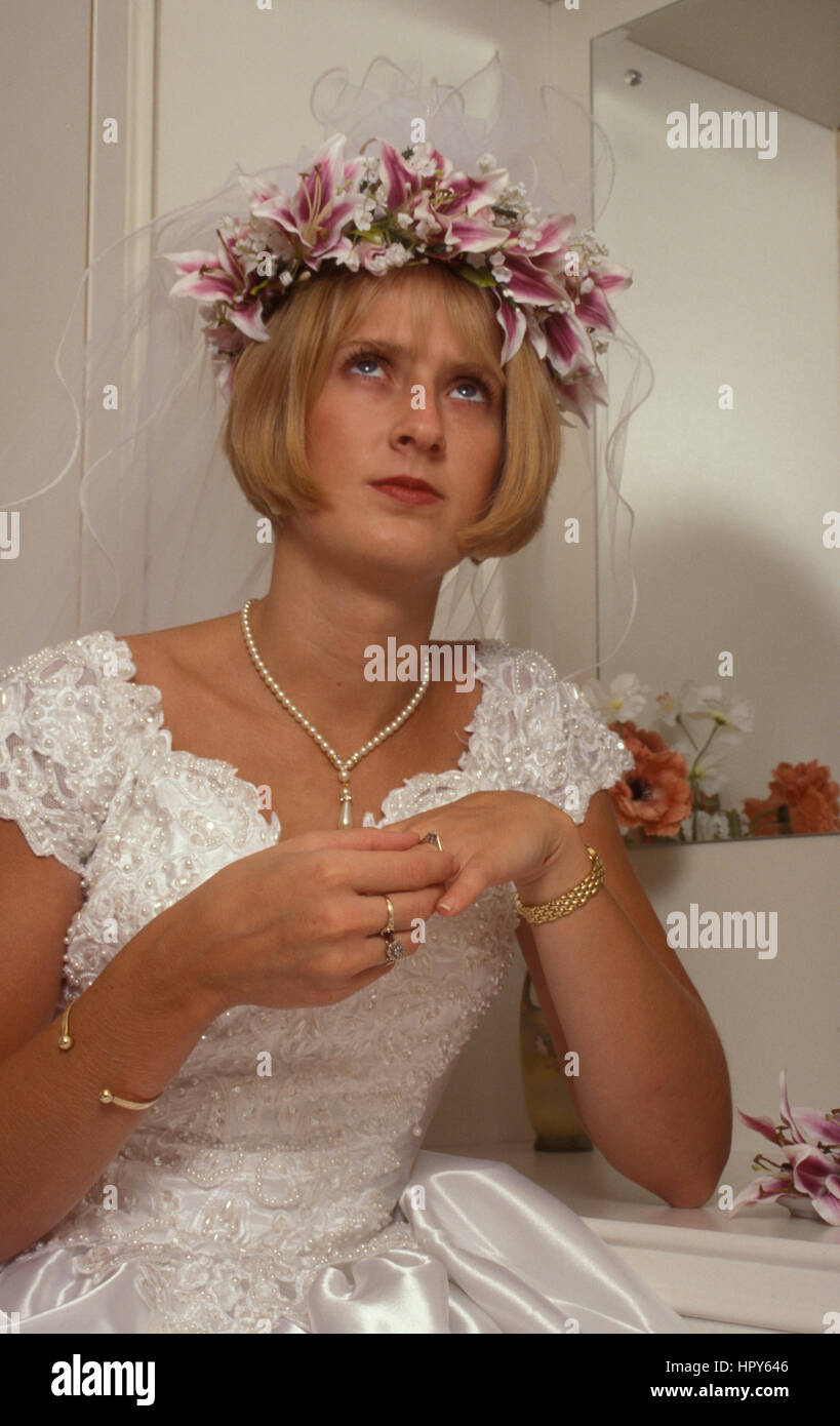 worried young bride getting ready for her wedding, could be having ...