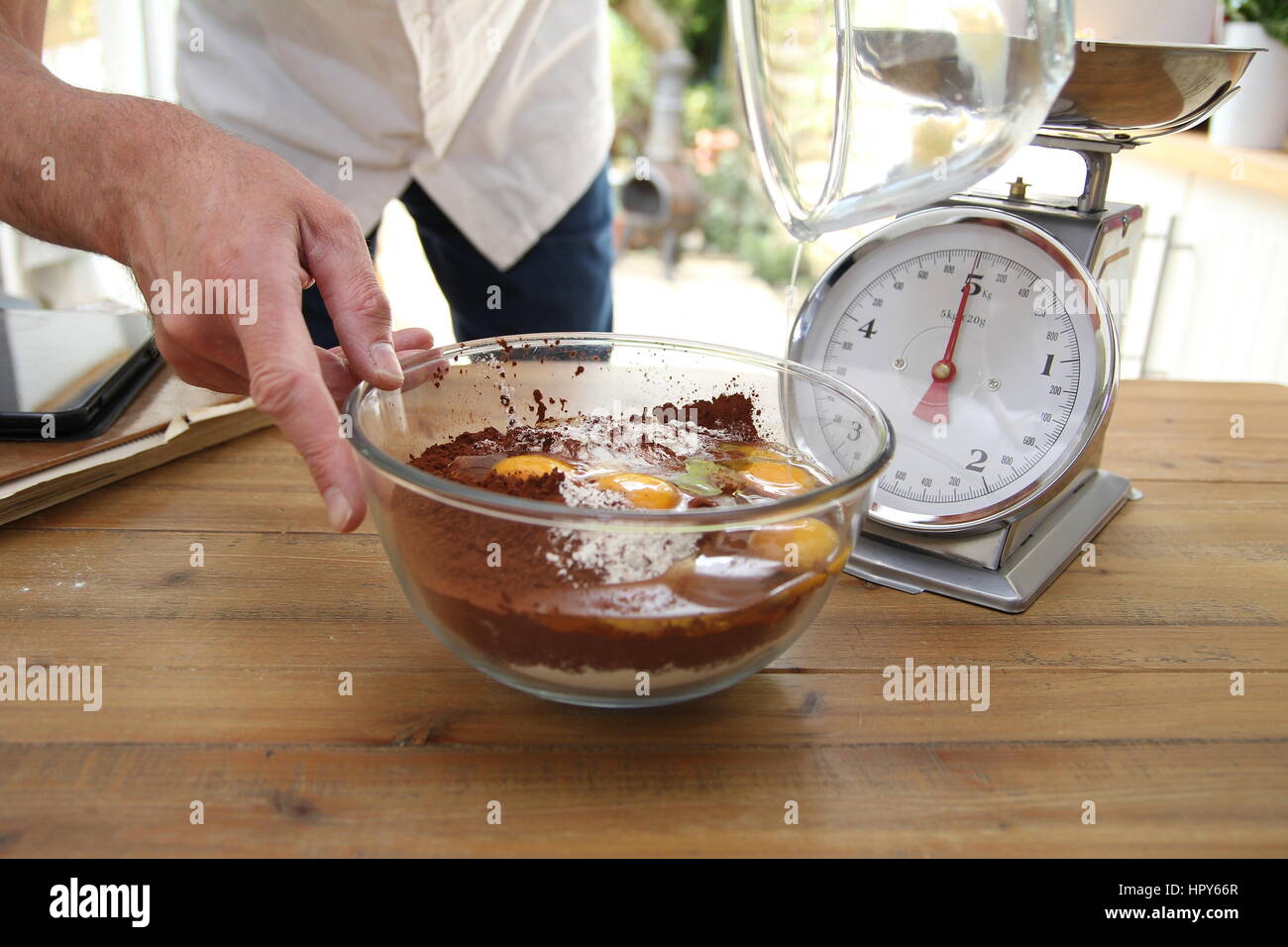 Mature man learning to make a chocolate cake Stock Photo - Alamy