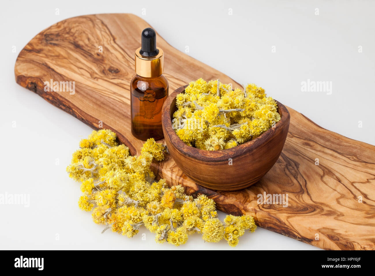 Dwarf everlast flowers and aroma oil isolated on the white Stock Photo ...