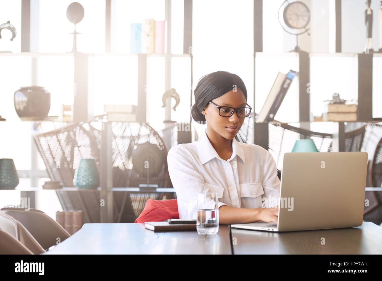 Professional black entrepreneur and businesswoman busy working on her ...