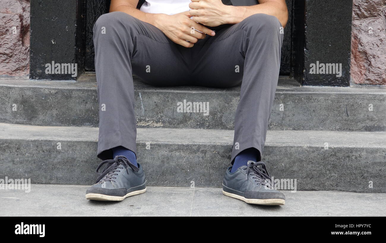 Man Sitting On Steps Stock Photo - Alamy