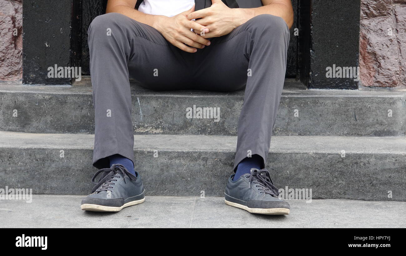 Legs And Feet Of Man Sitting Stock Photo - Alamy