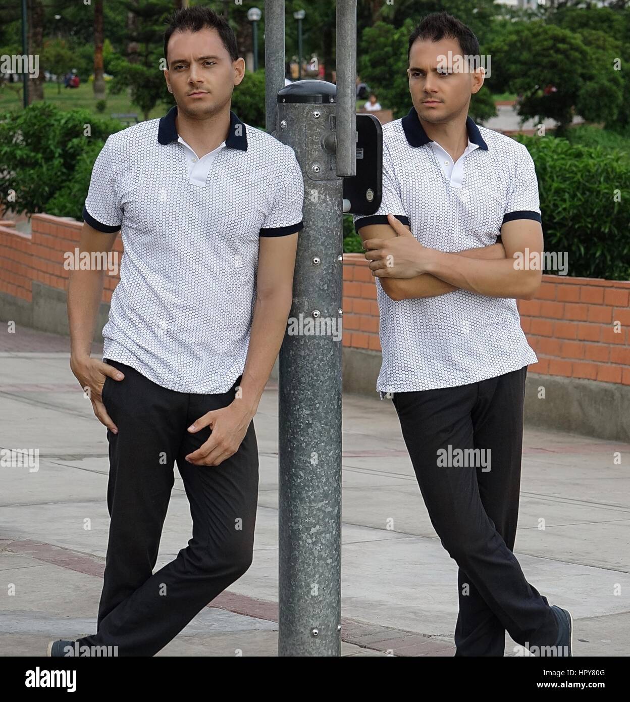 Italian Man Posing As Twin Brothers Stock Photo - Alamy