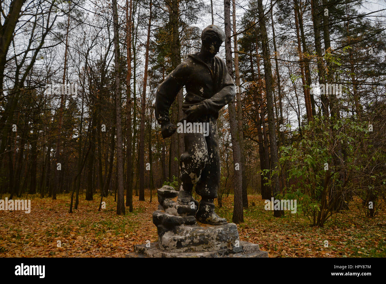 Forgotten statue in the forest Stock Photo - Alamy