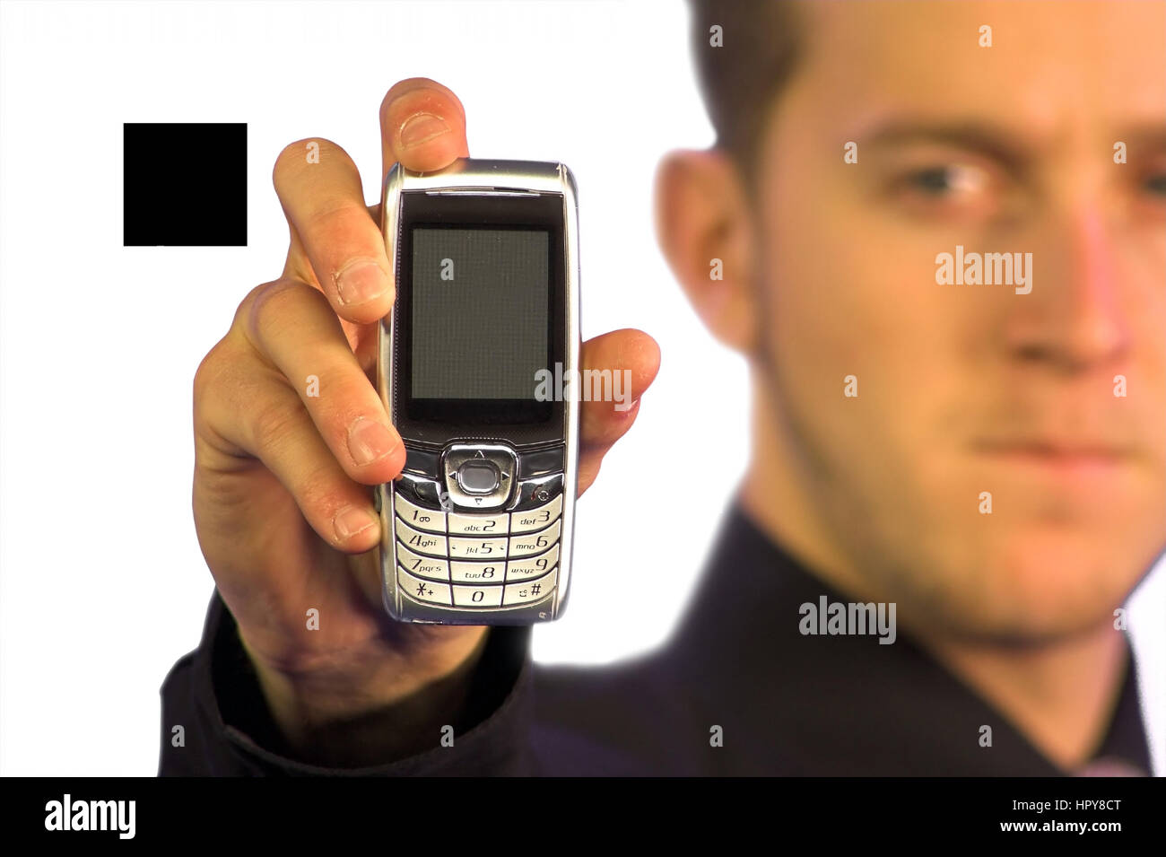 business man showing a mobile phone. Place any photo/text on the mobile ...