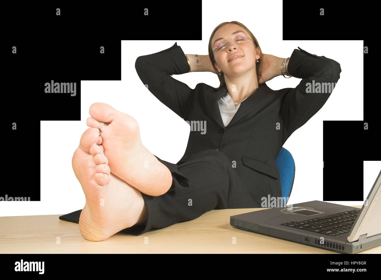 beautiful woman relaxing at her office with her feet up Stock Photo - Alamy