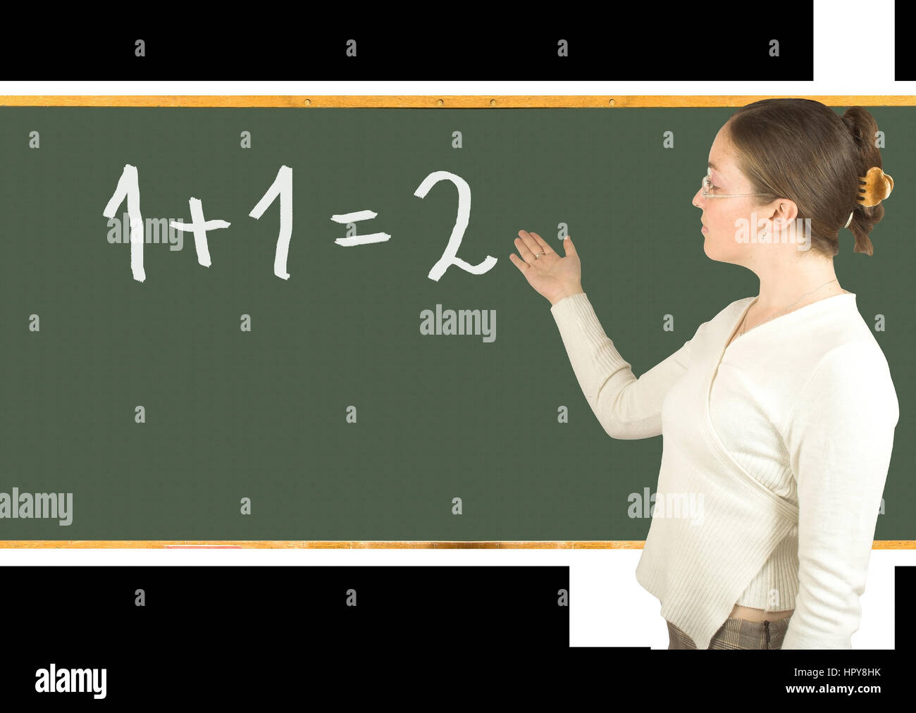 Teacher on blackboard Stock Photo - Alamy