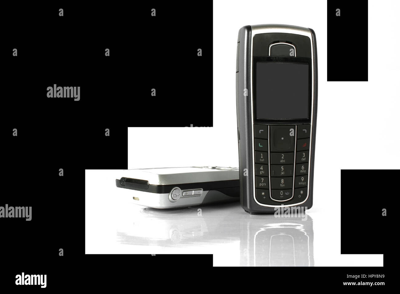 two mobile phones with reflection at the bottom Stock Photo - Alamy