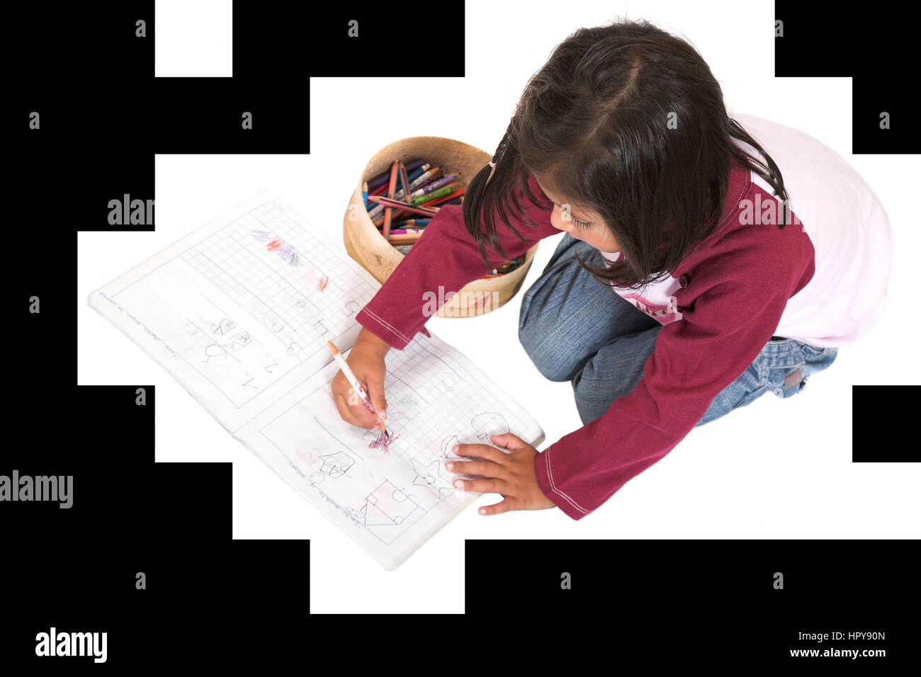 little kid drawing pictures on a notebook over white - focus on face ...