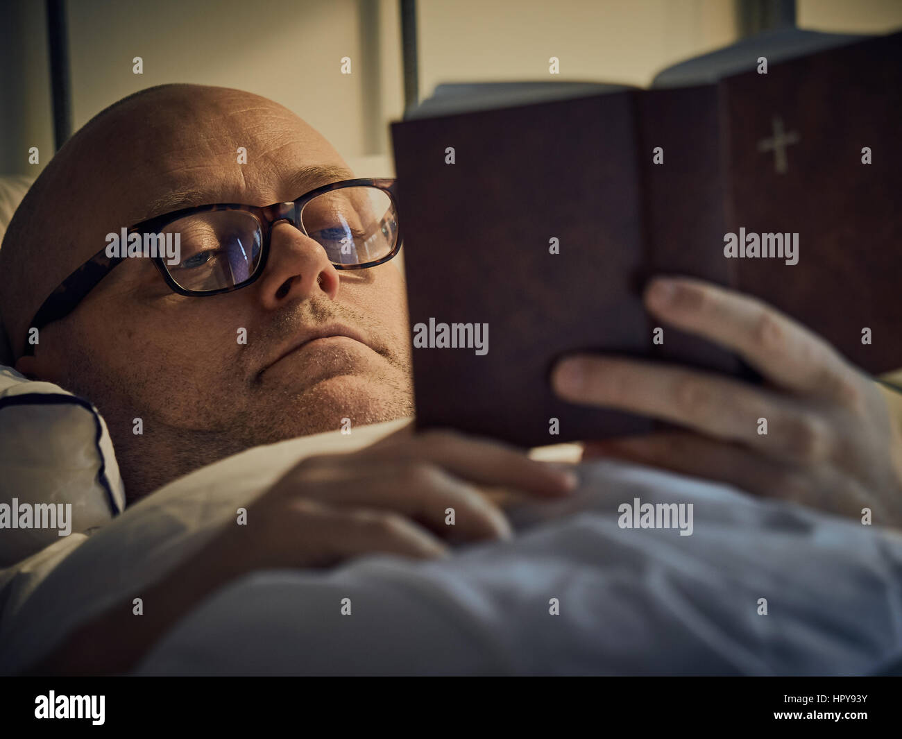 Man reading holy book hi-res stock photography and images - Alamy