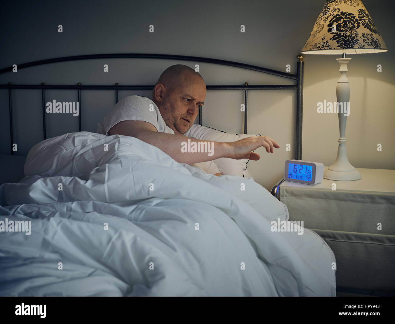 Middle aged man wakes up in the morning Stock Photo - Alamy