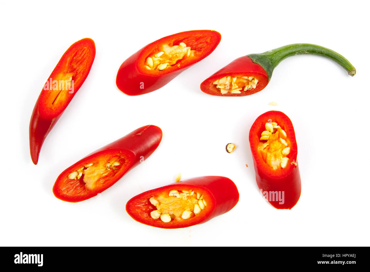 cut red hot chili peppers capsicum on a white background Stock Photo ...